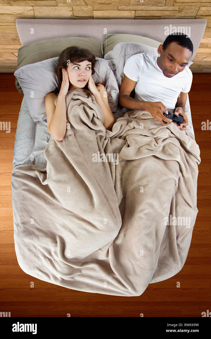 Tired female gamer playing video games hi-res stock photography and ...