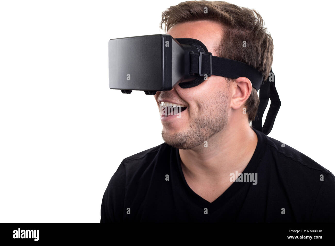 Caucasian model wearing a virtual reality headset on a white background ...