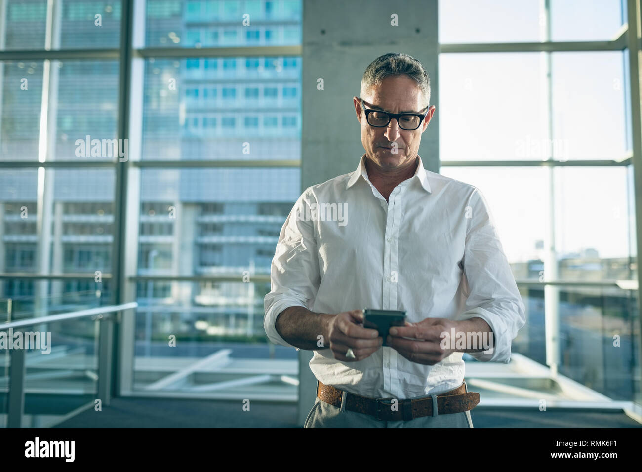 Watching mobile phone hi-res stock photography and images - Alamy