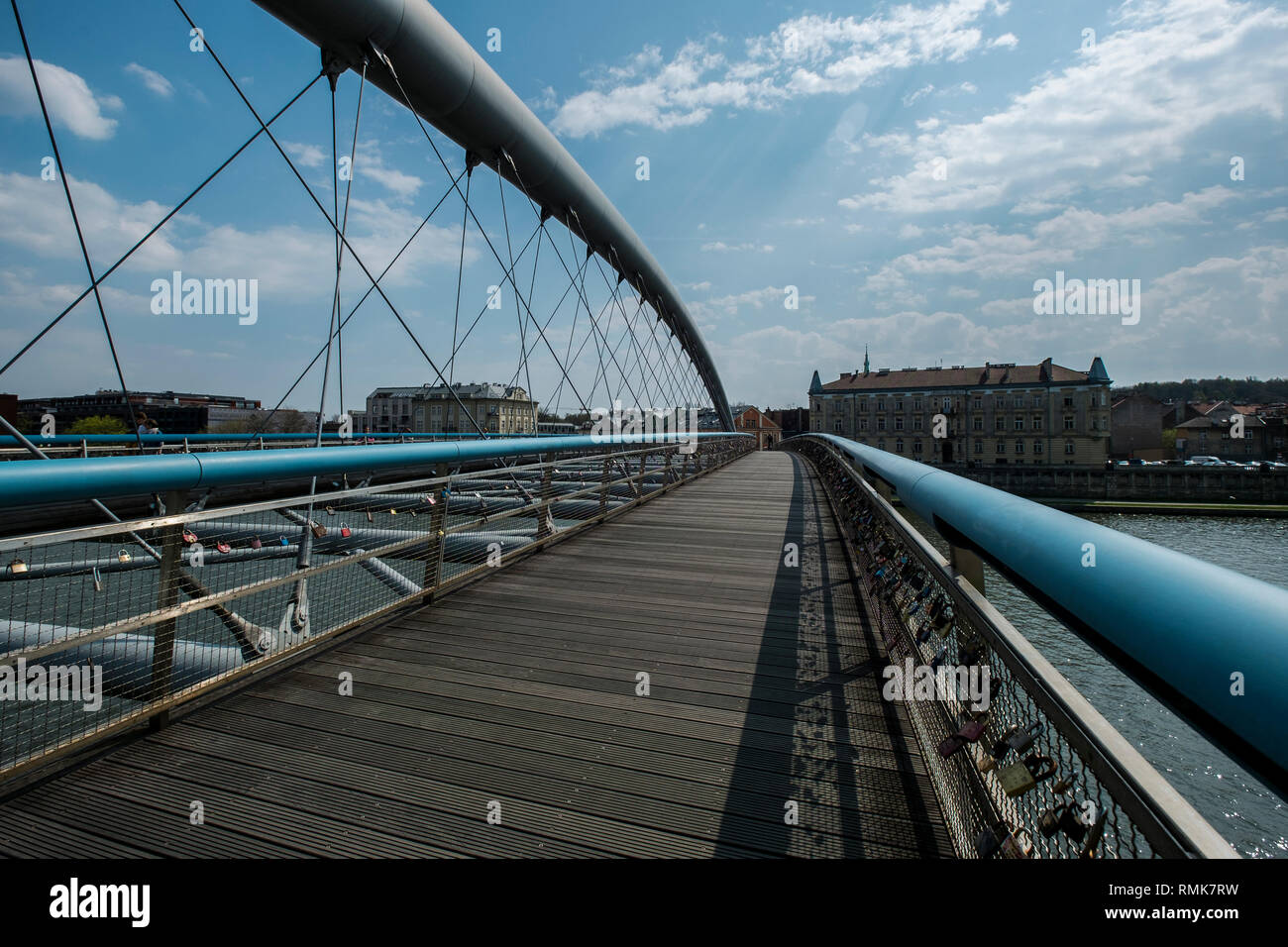 A new pedestrian and bicycle bridge crosses the Vistula river in Krakow ...