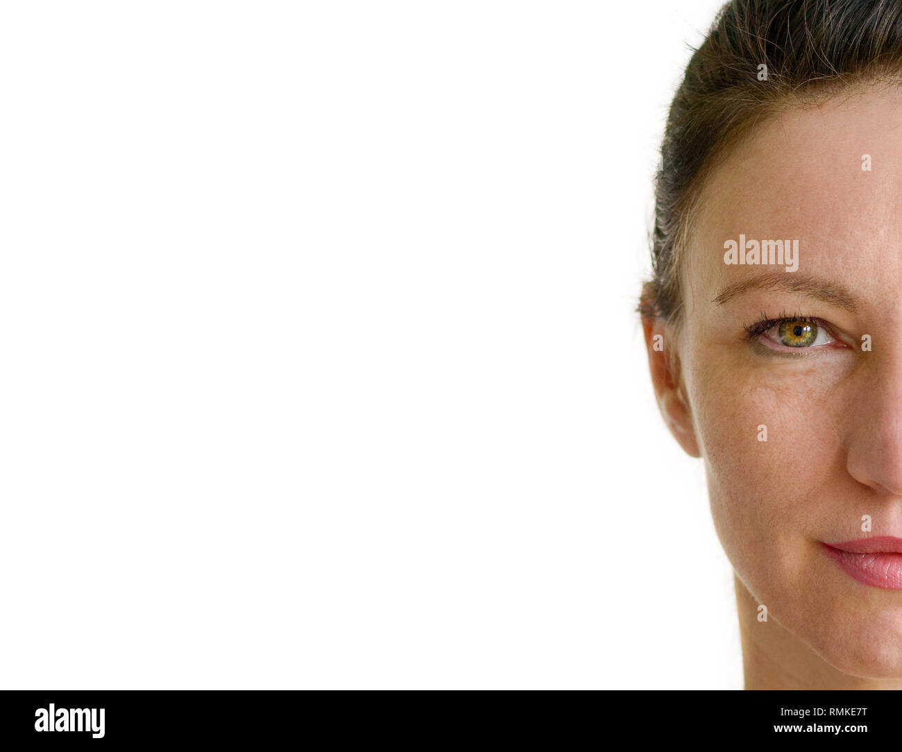 Half face portrait of an attractive brunette woman with green eyes ...