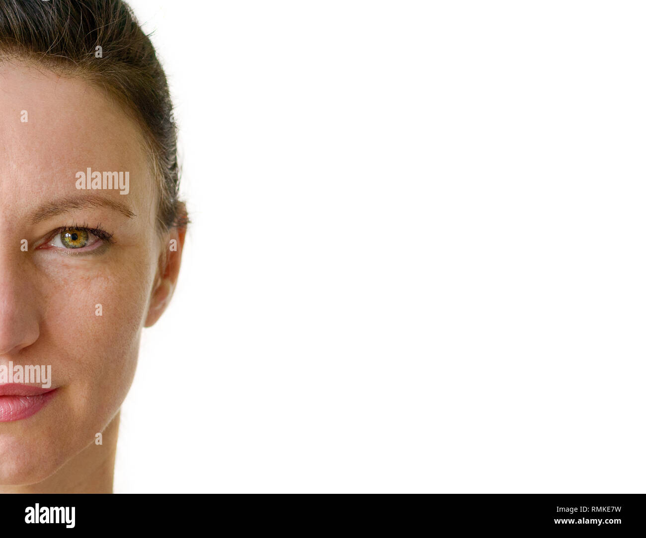 Half face portrait of an attractive brunette woman with green eyes ...