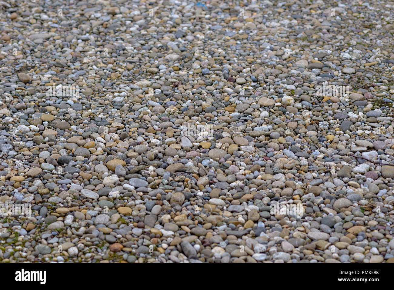 Coarse gravel ground surface, walkway or path with rounded smooth ...