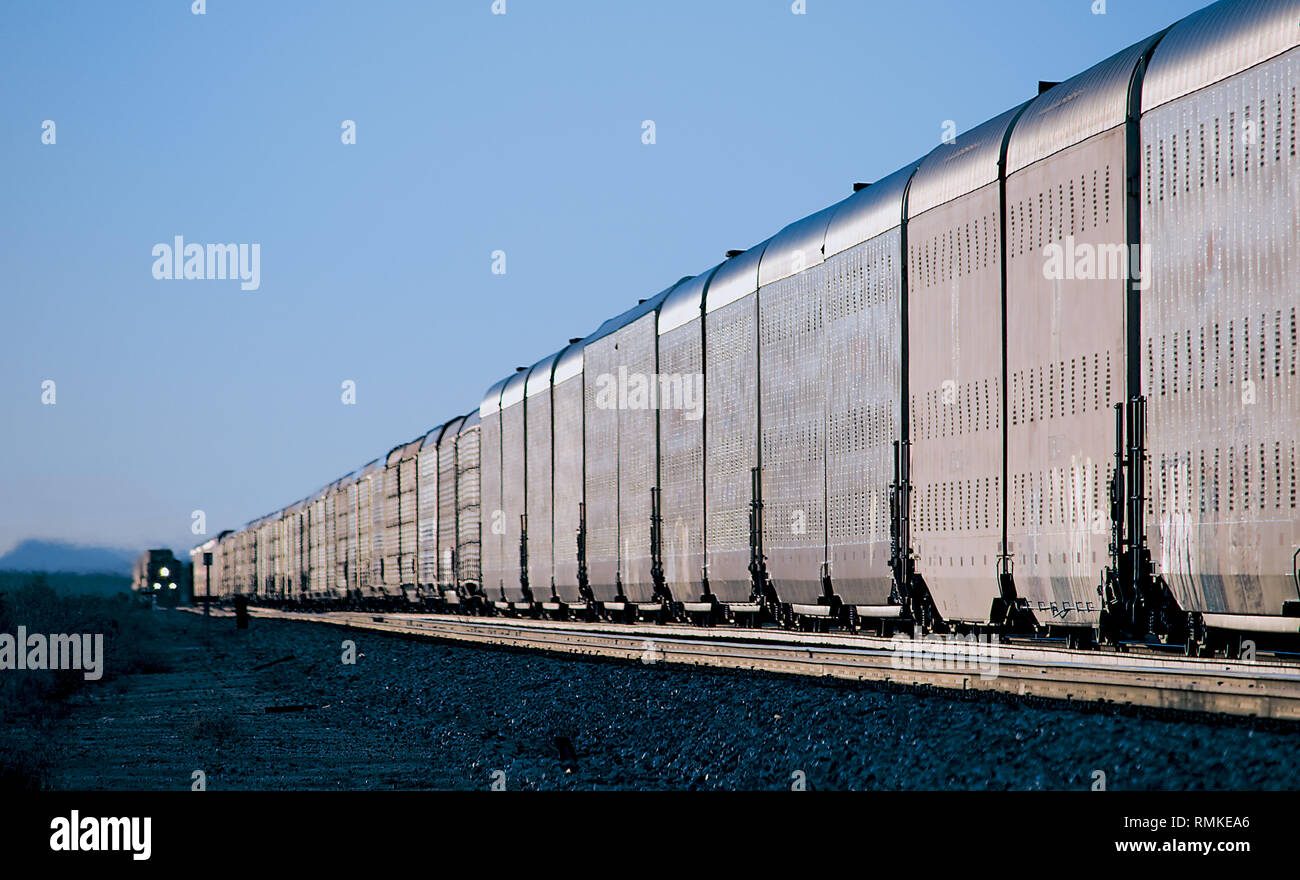 Automobile Train Meeting Doublestack Train in U.S. Desert Stock Photo ...