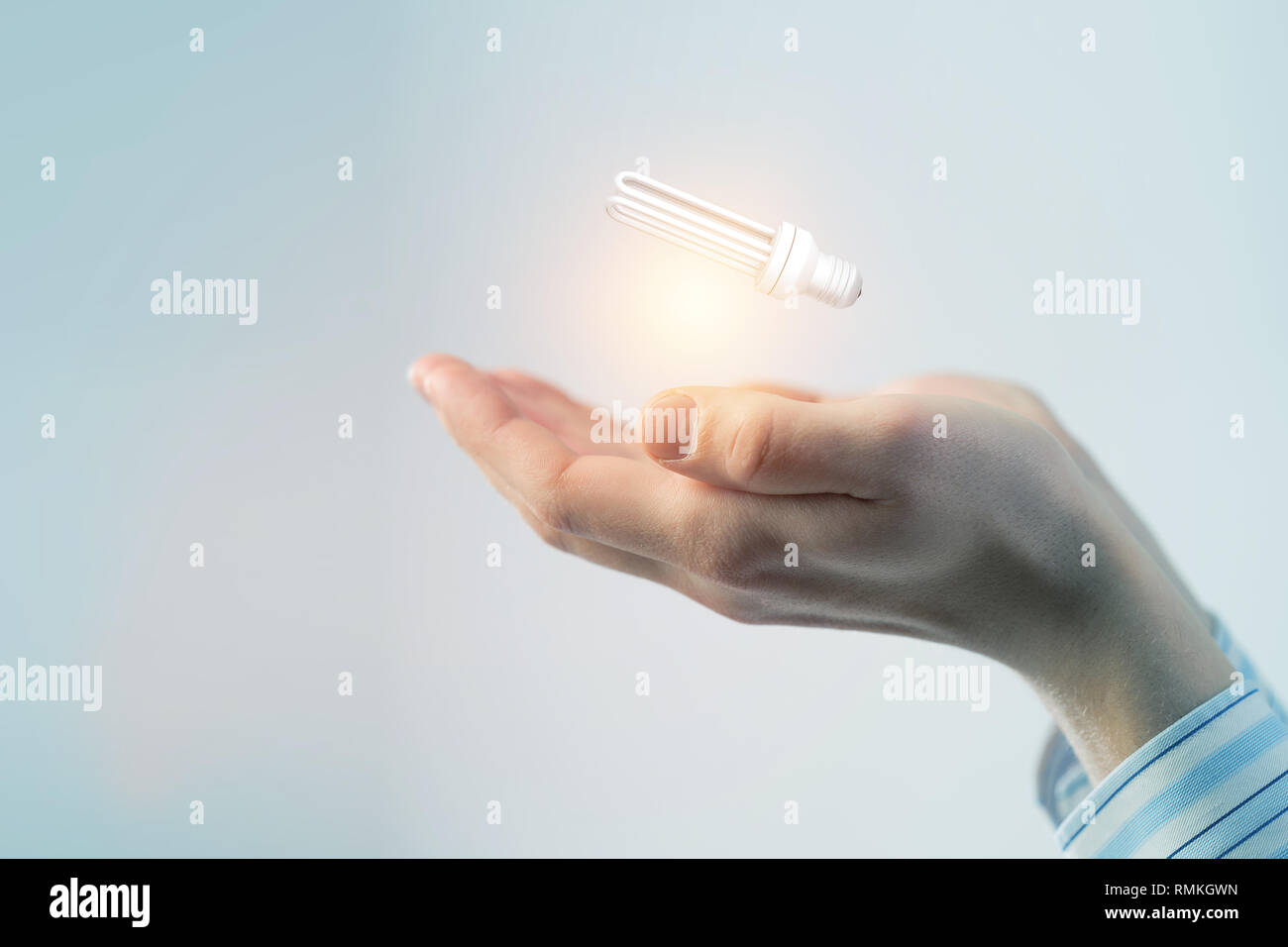 Glass bulb in hands Stock Photo - Alamy