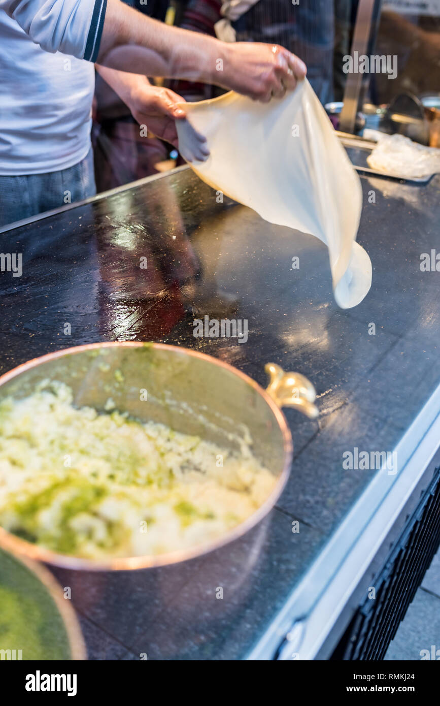 Man prepares Traditional Turkish Traditional Dessert Katmer,a popular ...