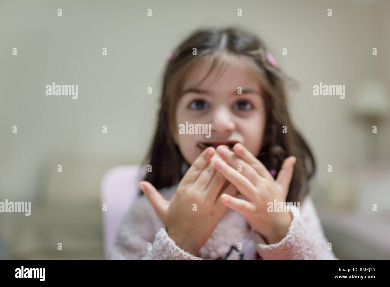 Girl eats chocolate hi-res stock photography and images - Alamy