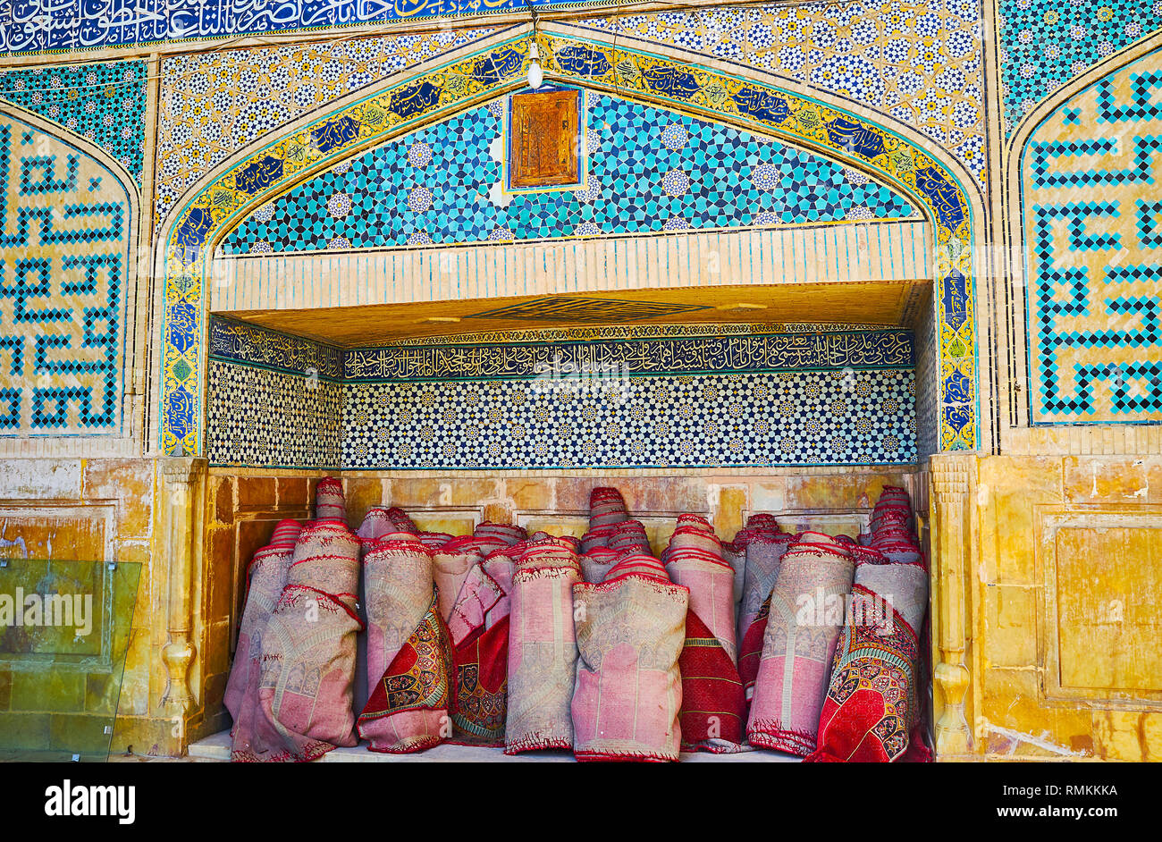 The niche in wall of the West portal of Jameh Mosque with rolls of ...