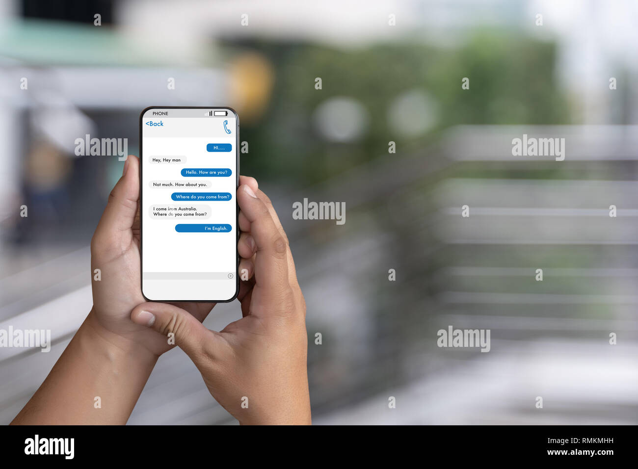 Man hand holding chatting with friends the smartphone Stock Photo - Alamy