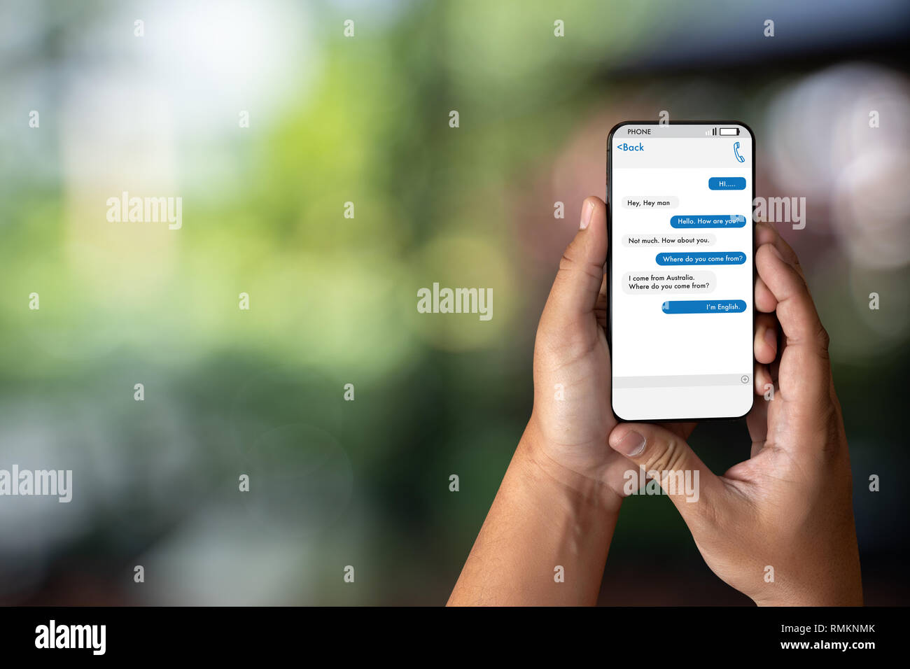 Man hand holding chatting with friends the smartphone Stock Photo - Alamy