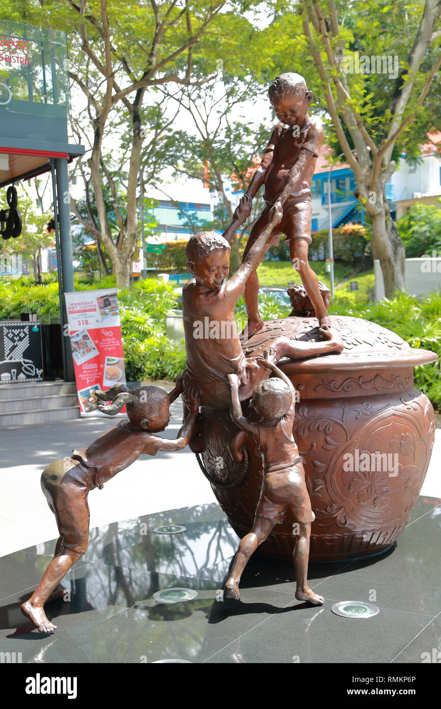 Bronze Sculpture of children playing in Orchard Rd, Singapore Stock ...