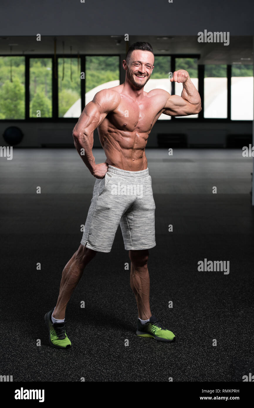 Portrait Of A Young Physically Fit Man Showing His Well Trained Body ...