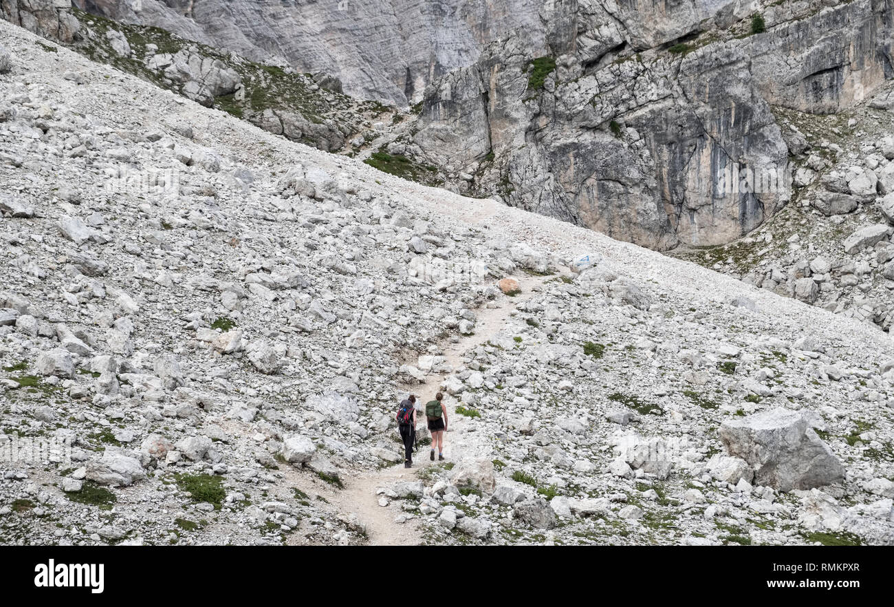 Two hikers on the Alta Via 1 long distance trail in the Italian ...