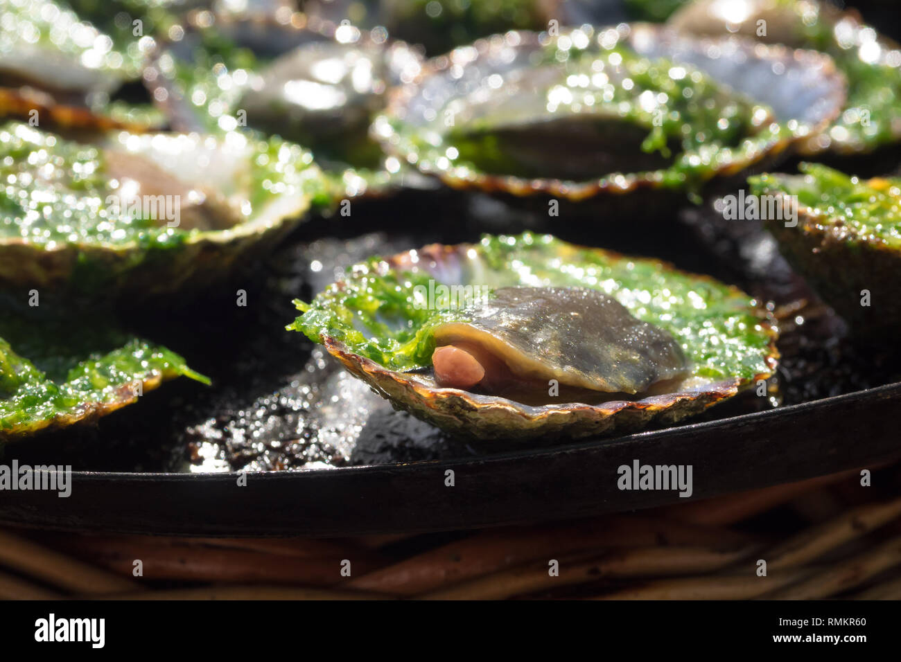 grilled limpets with green mojo, typical avocado in Lanzarote, Canary ...