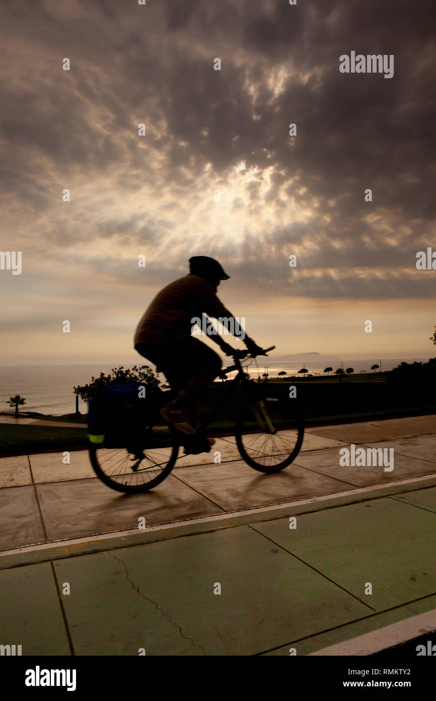 Bicycle rider figure riding at Lima's coastline Stock Photo - Alamy