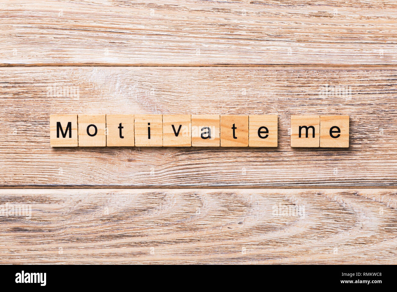 Motivate me word written on wood block. Motivate me text on wooden ...