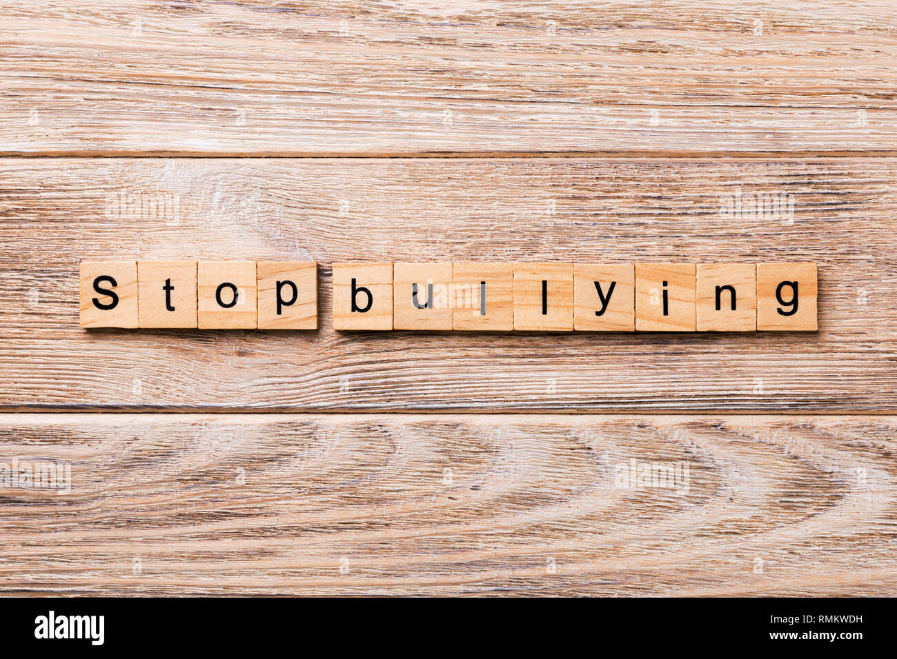 Stop Bullying word written on wood block. Stop Bullying text on wooden ...