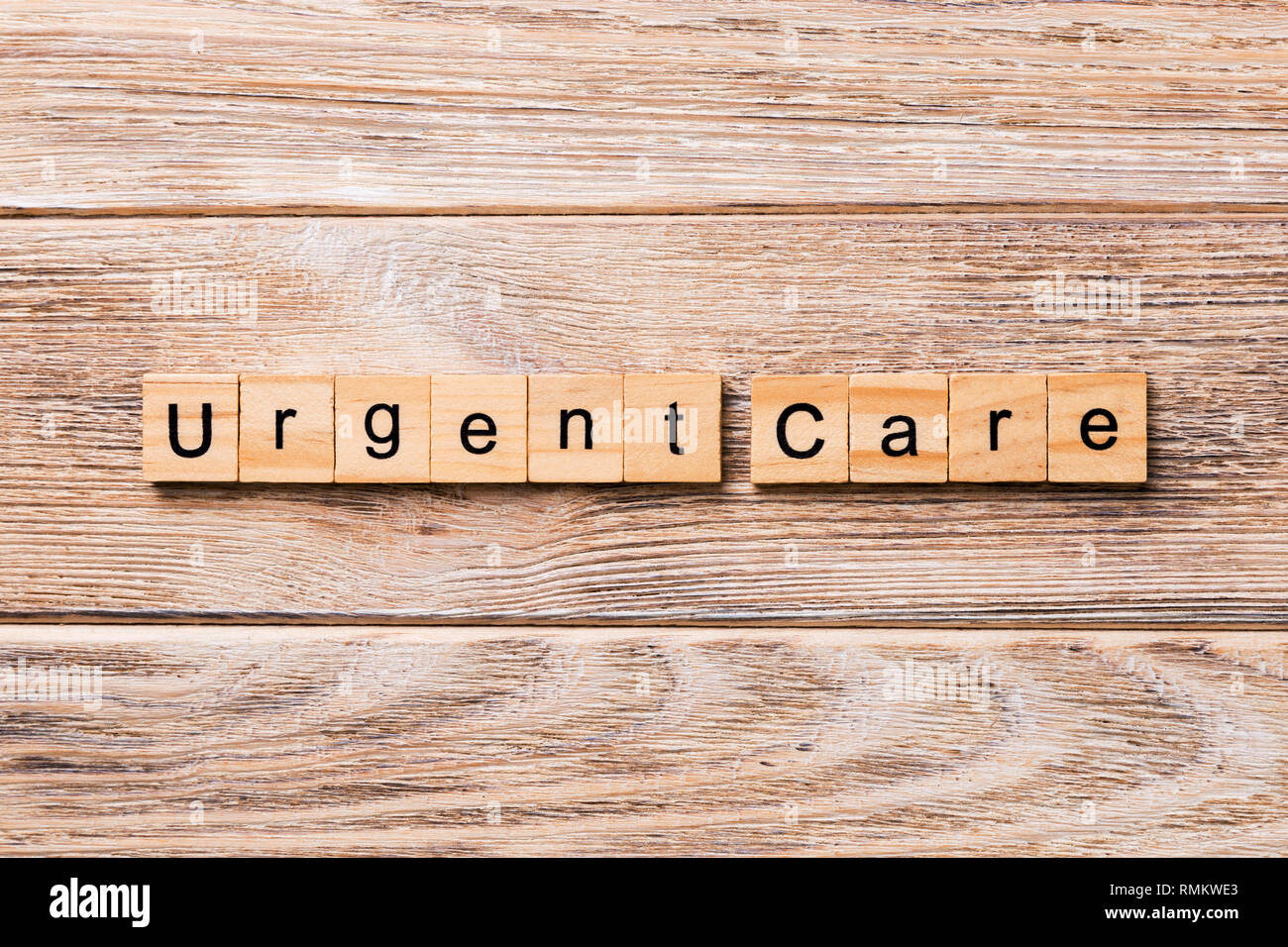 Urgent care word written on wood block. Urgent care text on wooden ...