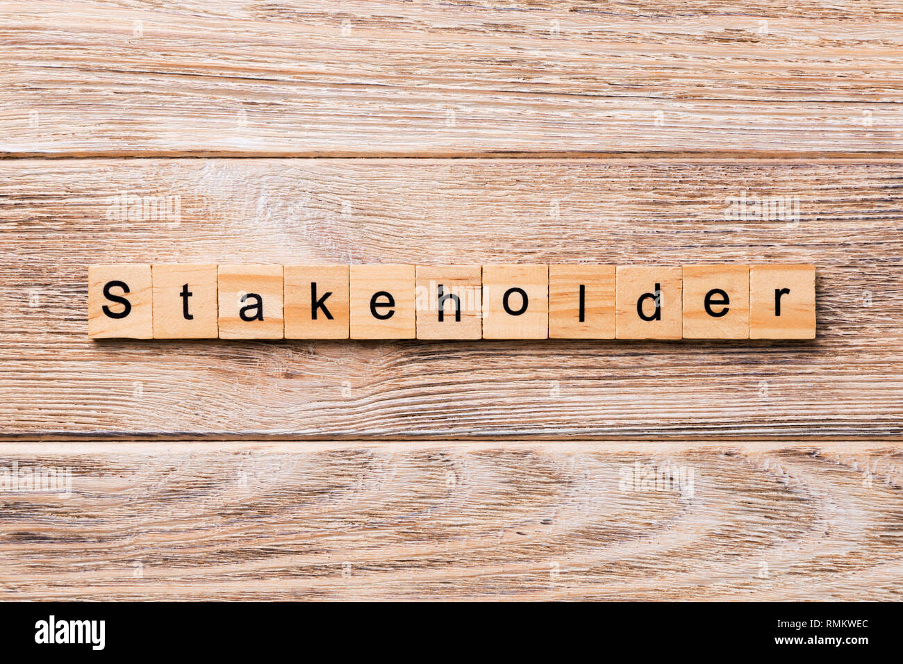 Stakeholder word written on wood block. Stakeholder text on wooden ...