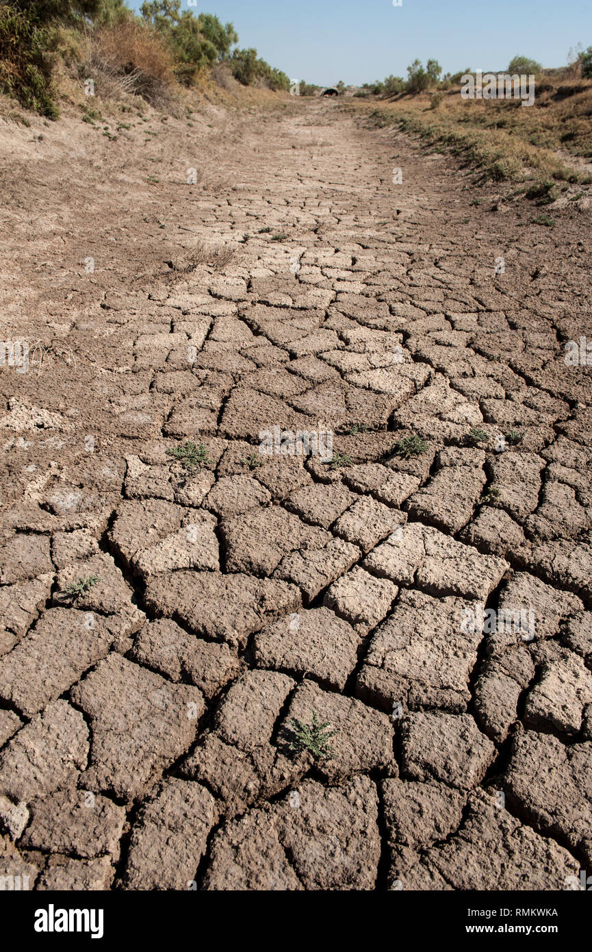 Cracked earth of dry river bed at Charax archaeological site near Basra ...