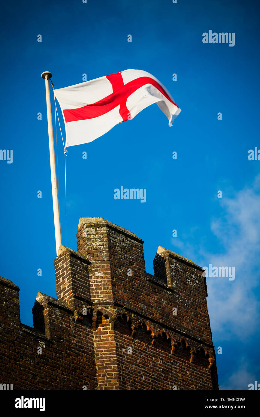 England flag flying above castle fortifications with blue sky Stock ...