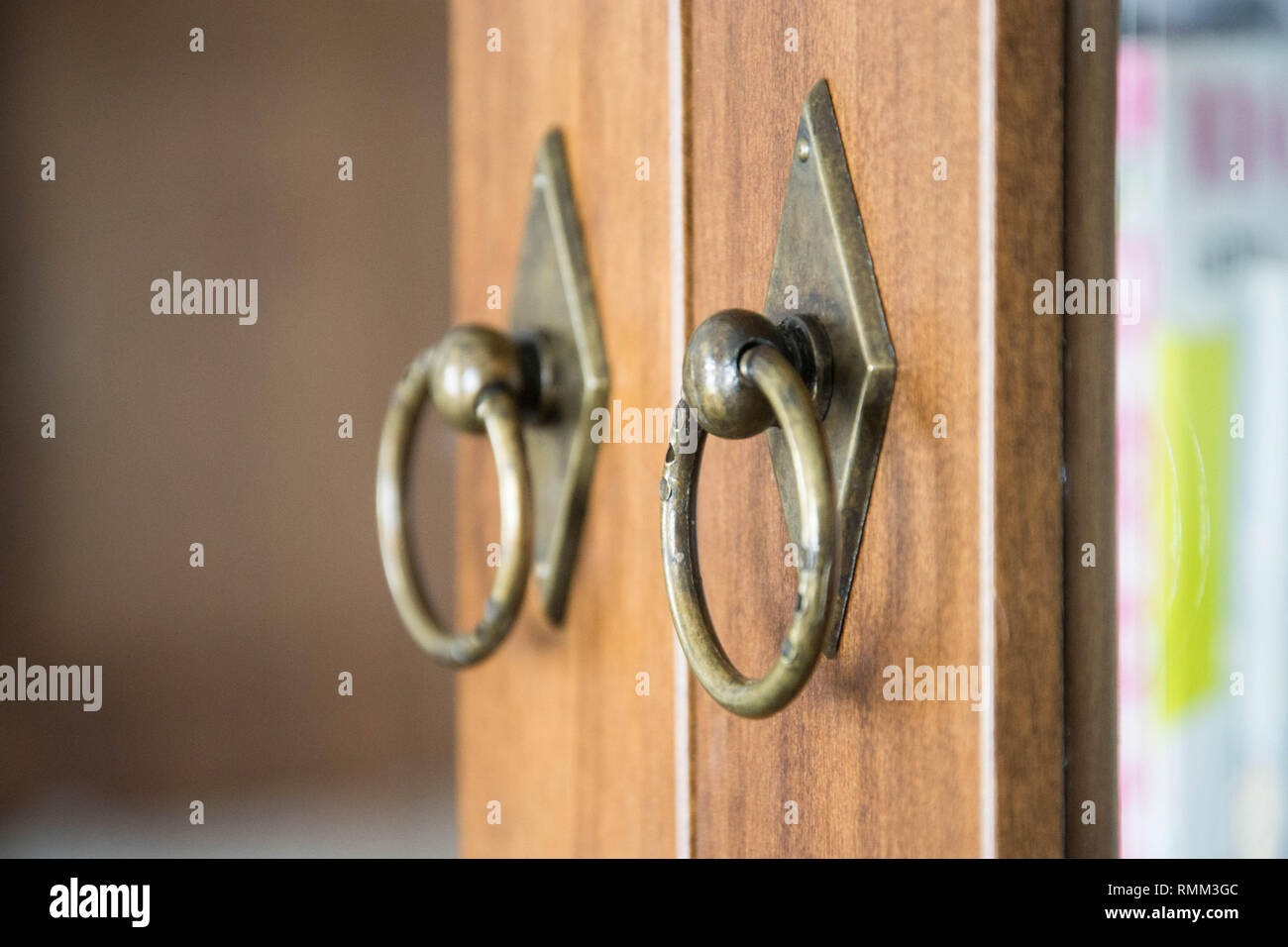 Metal handle knocker on wooden door, window, room interiour Stock Photo ...