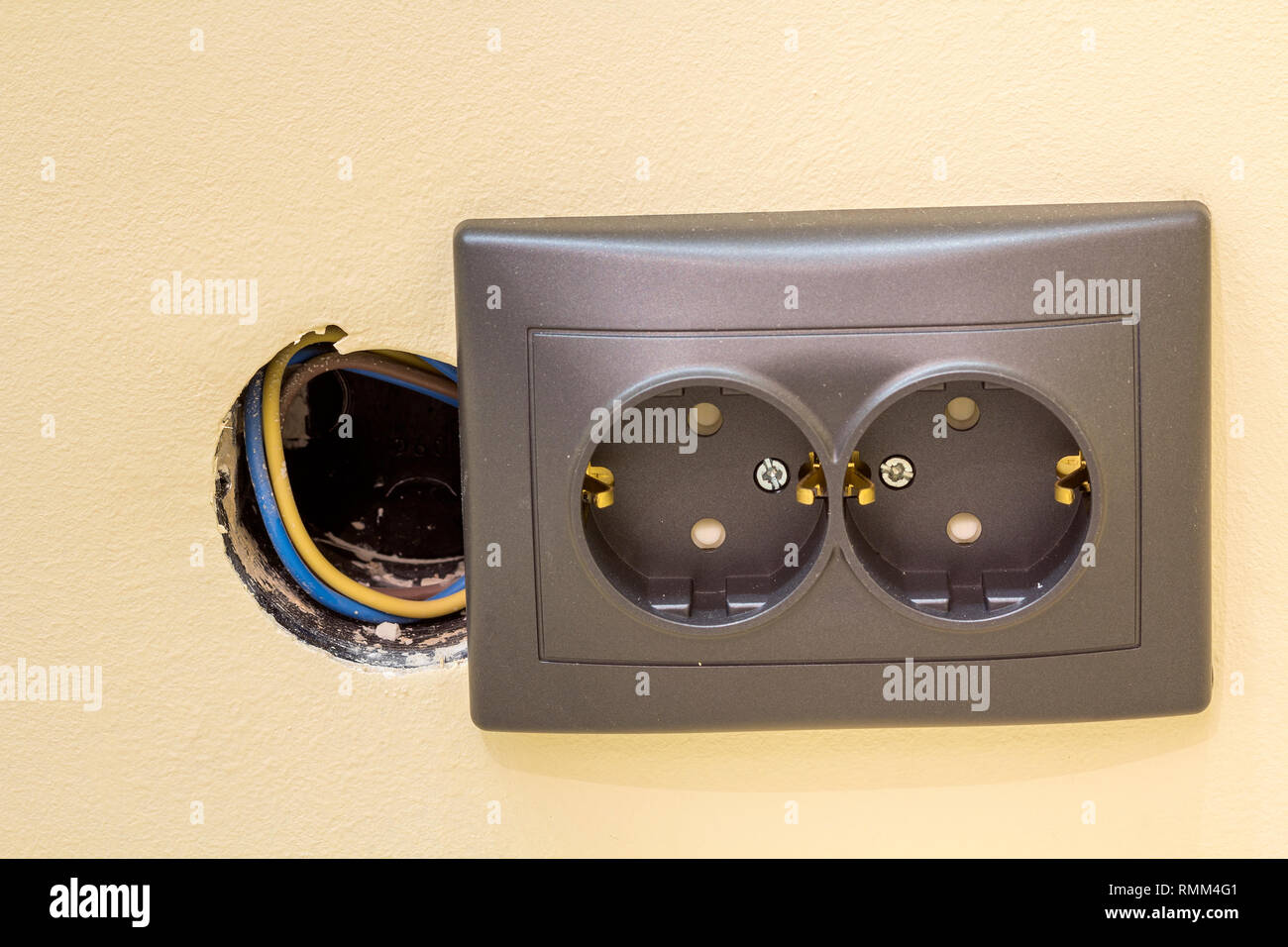 New gray power outlet socket with electric isolated colorful wires ...