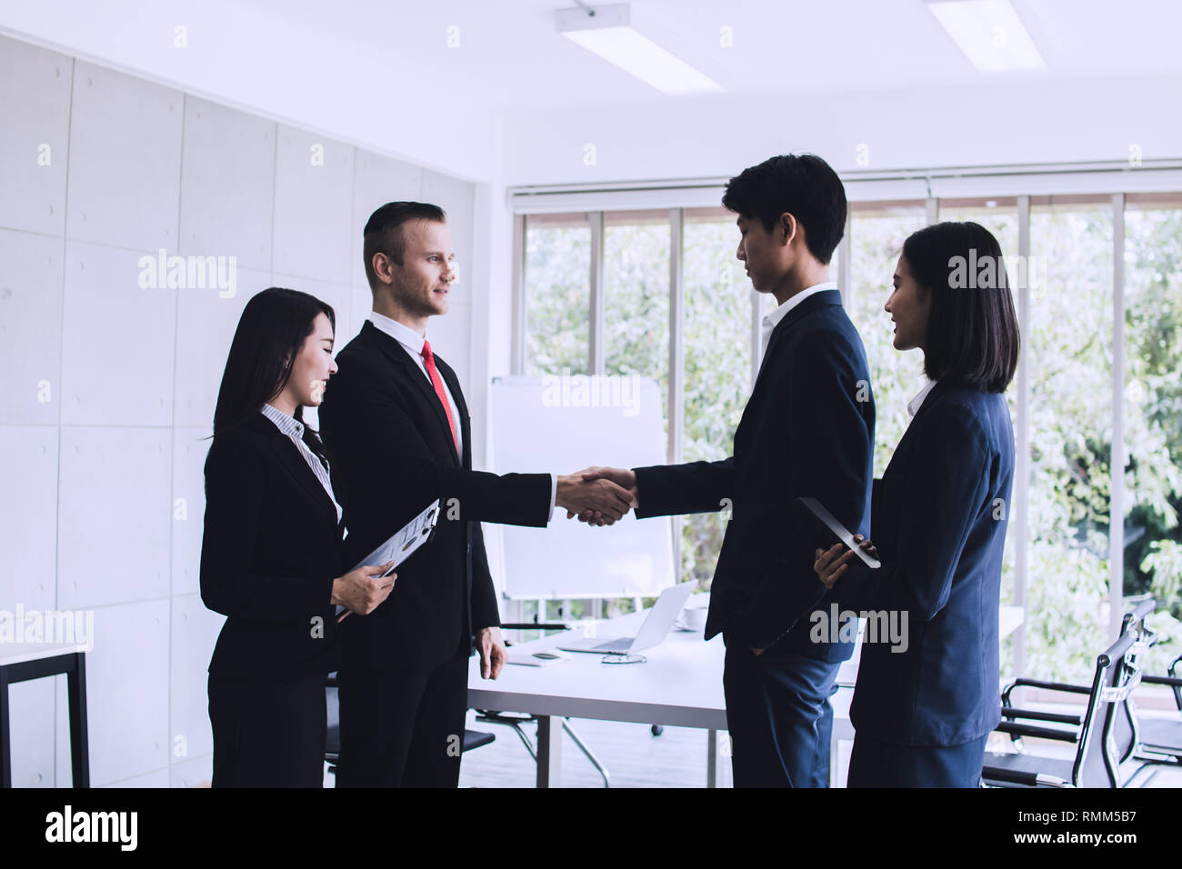 business people negotiate and shake hands after successful agreement ...