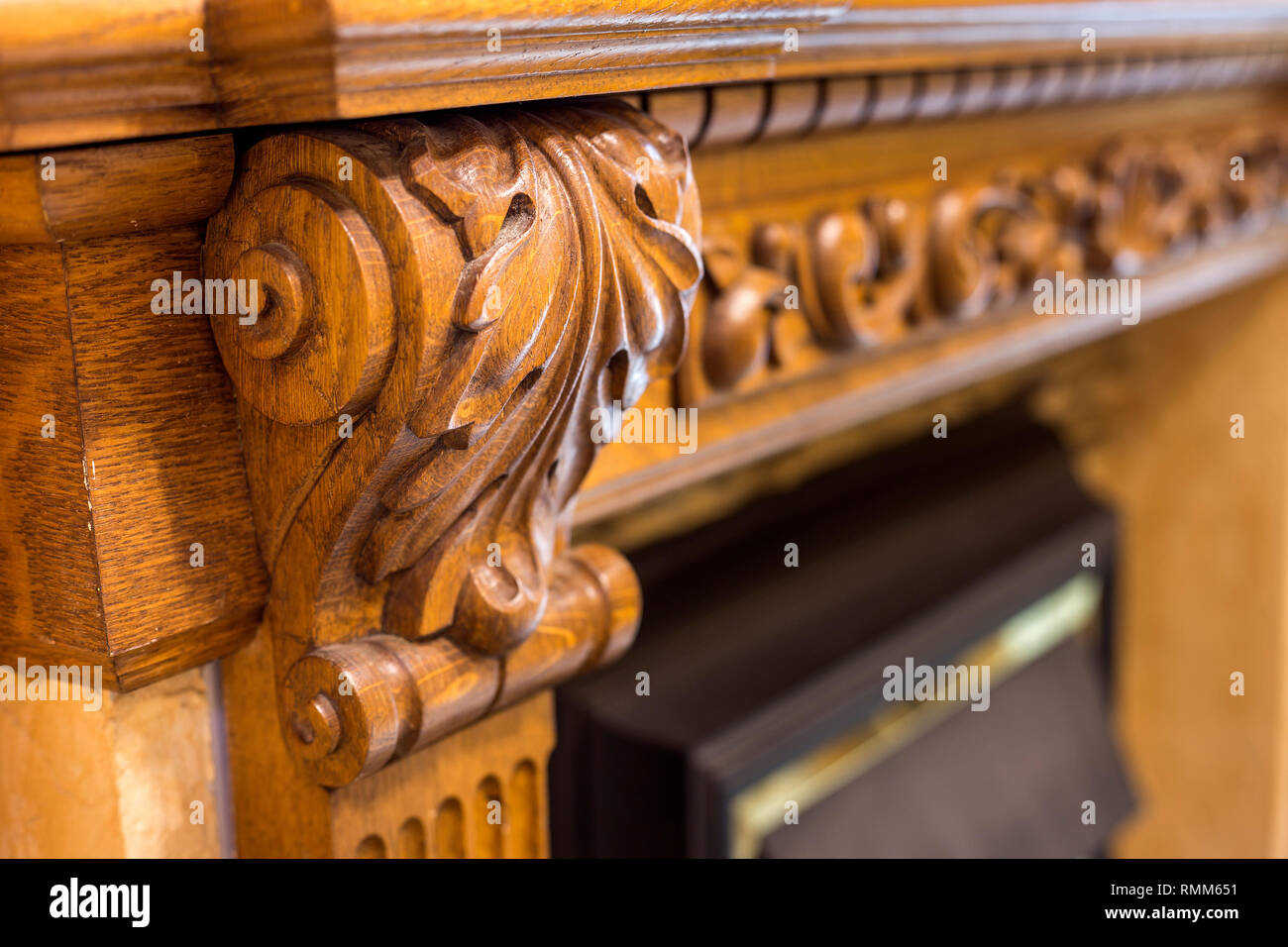 Close-up detail of carved wooden decorative piece of furniture with ...