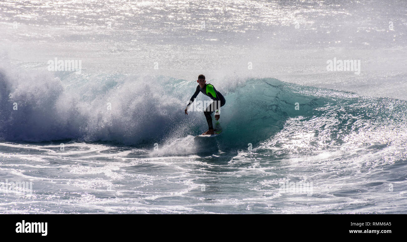 Rear View Of Man Surfing In Sea Stock Photo - Alamy