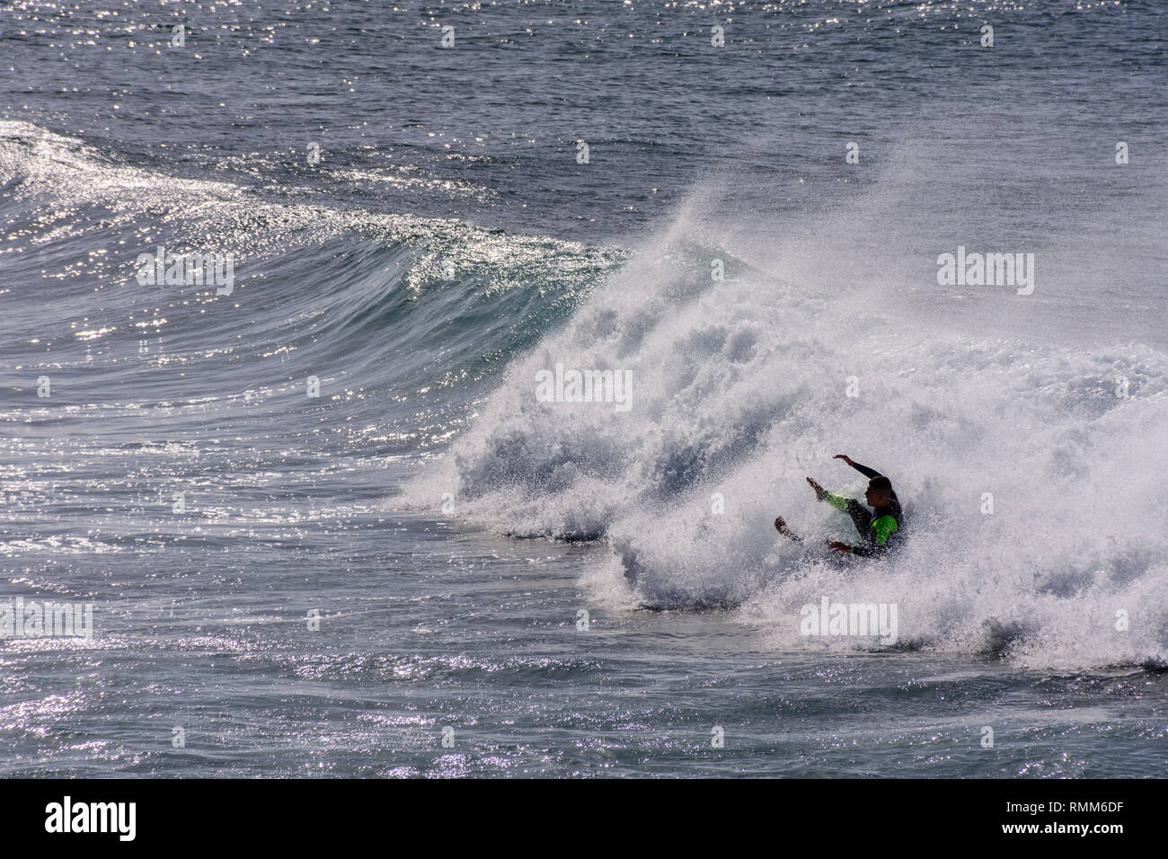 Rear View Of Man Surfing In Sea Stock Photo - Alamy