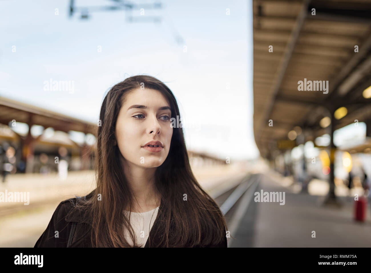 Wait on station platform hi-res stock photography and images - Alamy