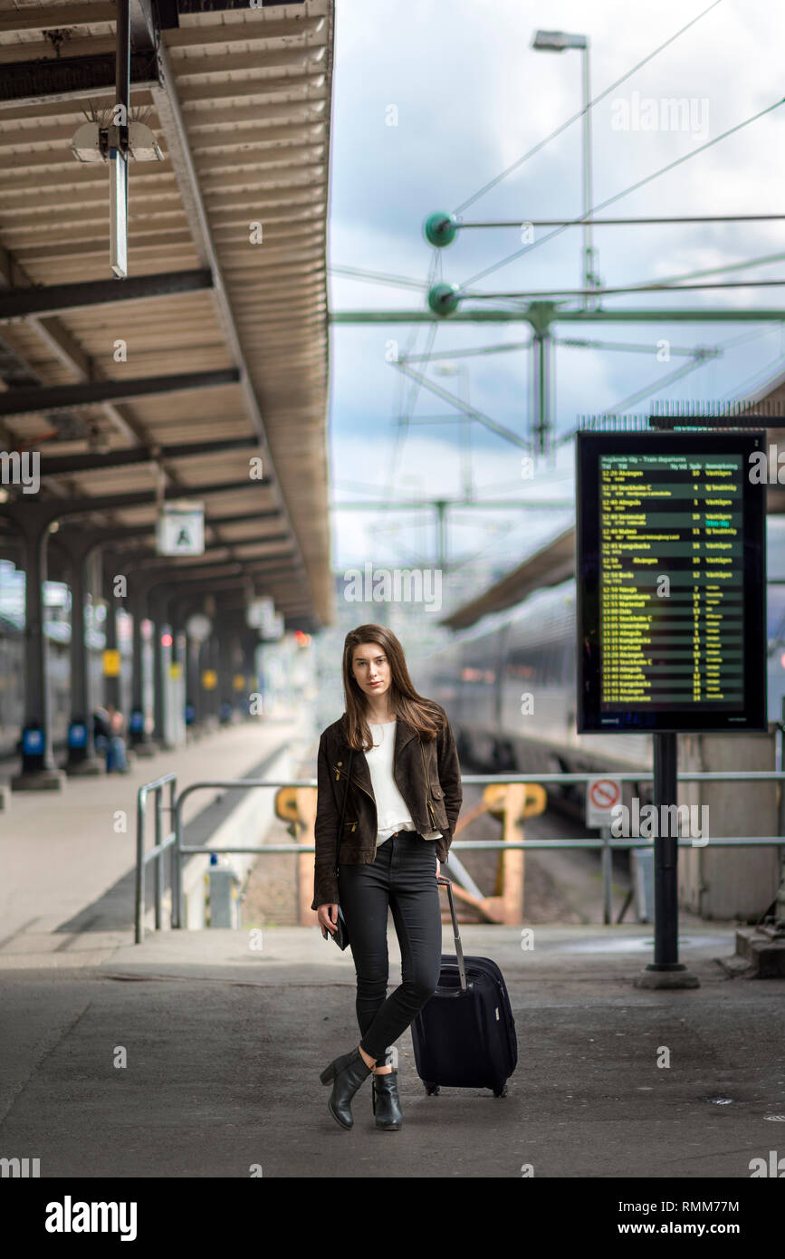 Woman suitcase full length station hi-res stock photography and images ...