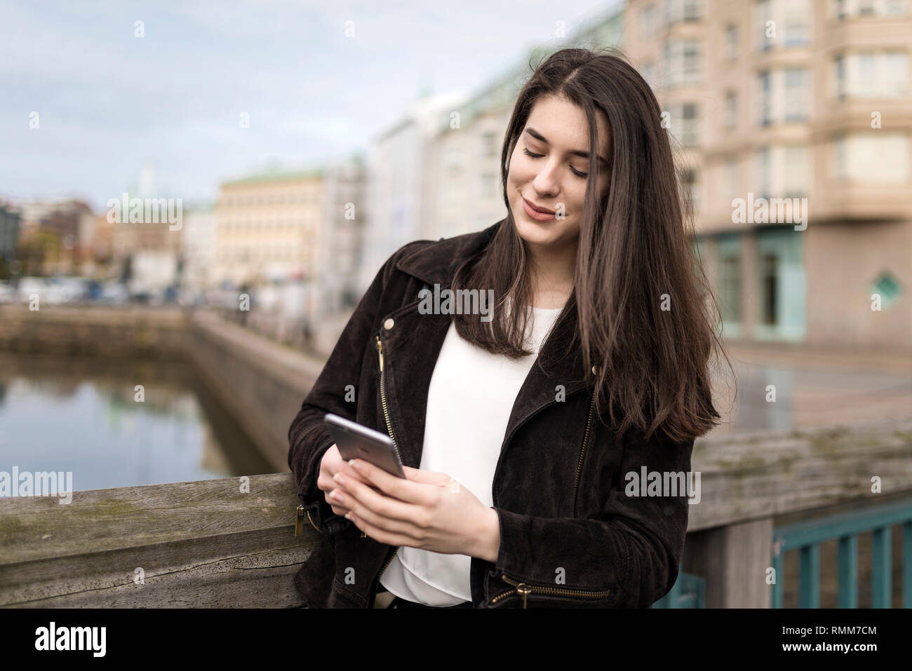 Woman using cell phone Stock Photo - Alamy