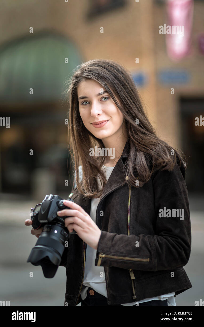 Young photographer woman holding camera hi-res stock photography and ...