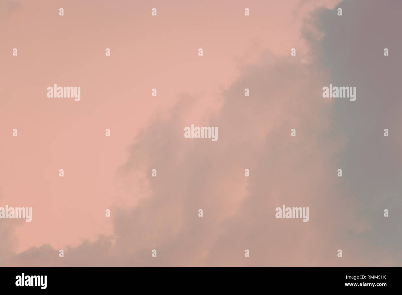 Coral colored sky background with clouds. Abstract image. Toned Stock ...
