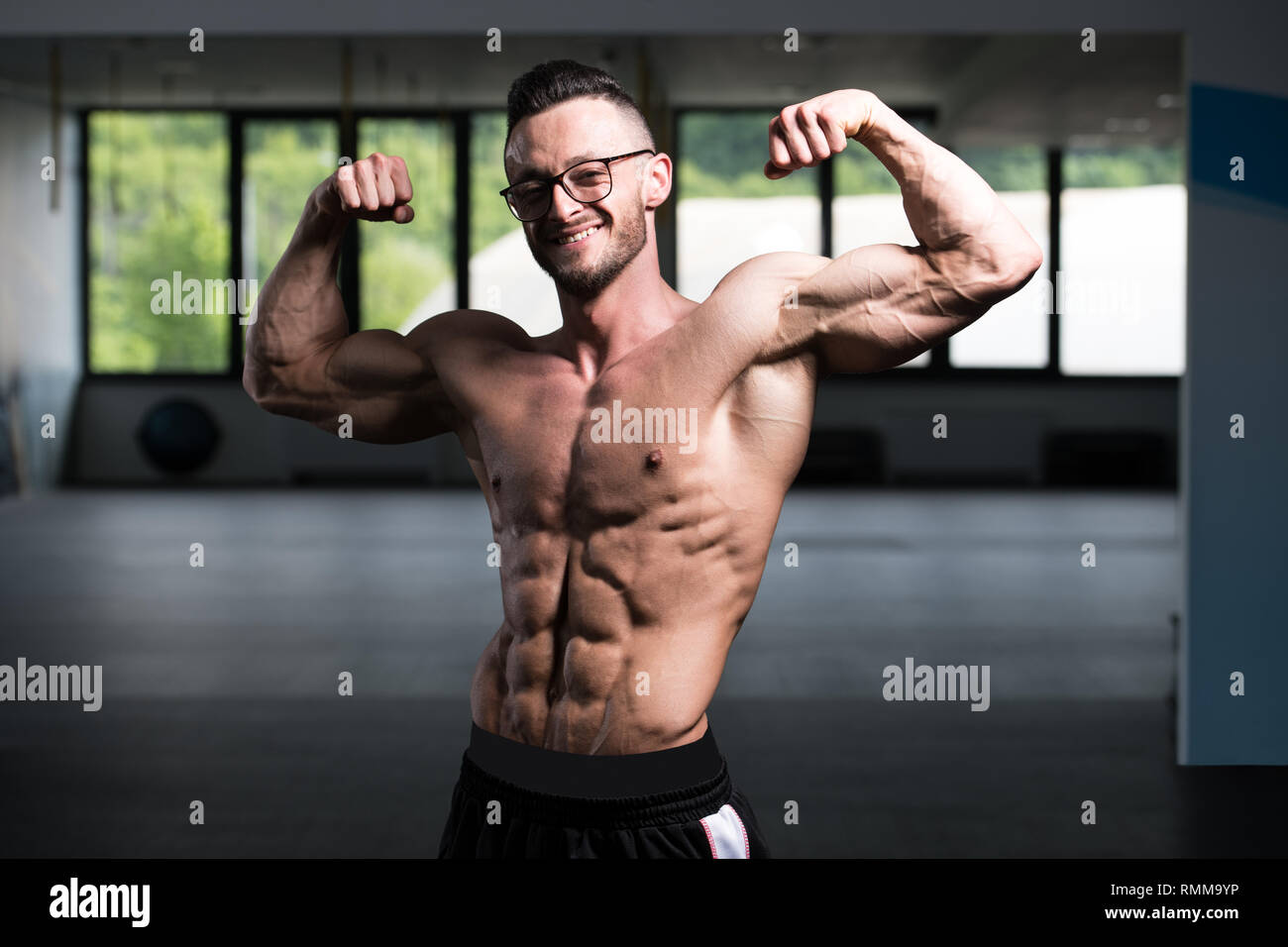 Geek flexing muscles hi-res stock photography and images - Alamy