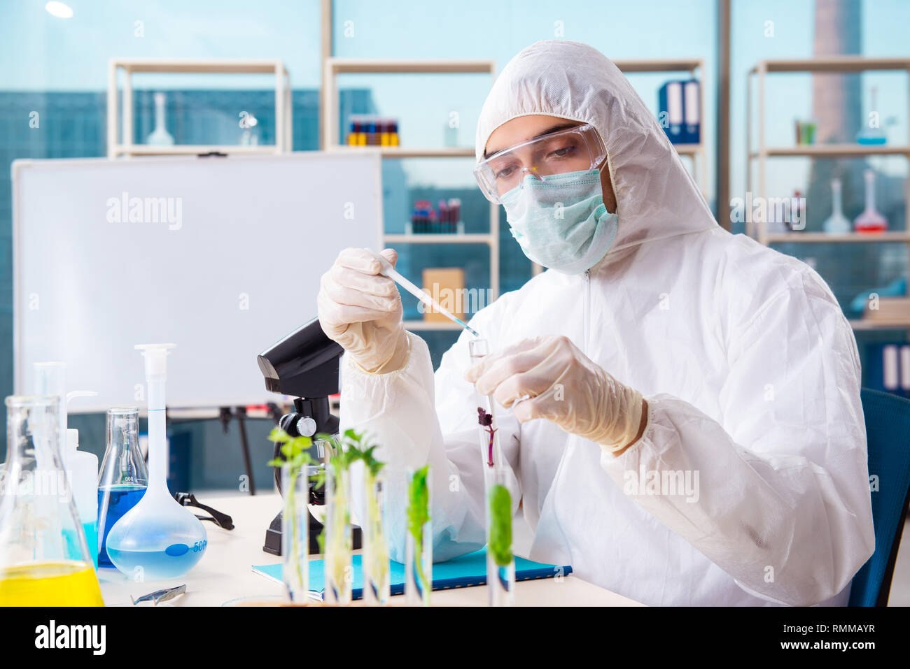 Male biotechnology scientist chemist working in the lab Stock Photo - Alamy