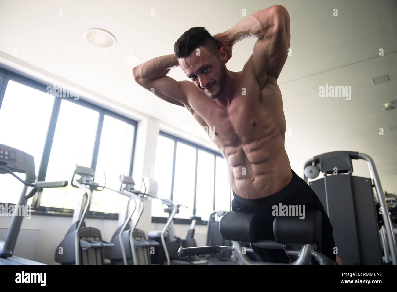 Handsome Muscular Fitness Bodybuilder Doing Heavy Weight Exercise For ...