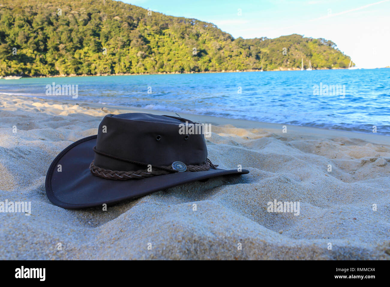 Hat on the beach Stock Photo - Alamy