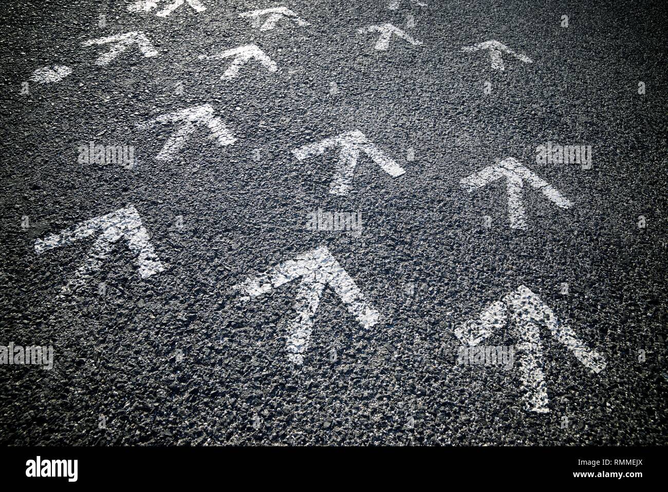 Directional arrows painted on a cement floor Stock Photo - Alamy