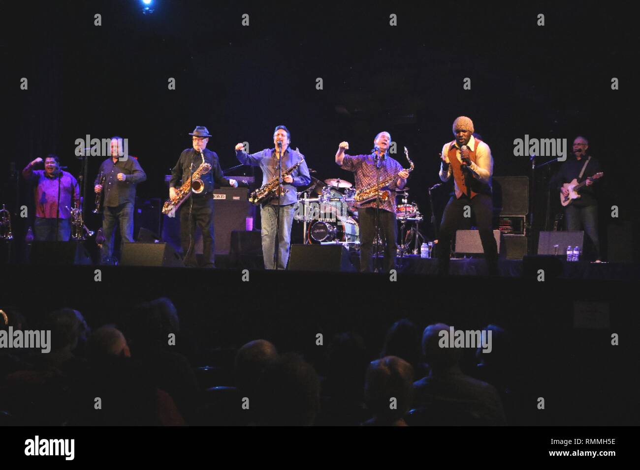 Tower of Power are shown performing on stage during a "live" concert ...