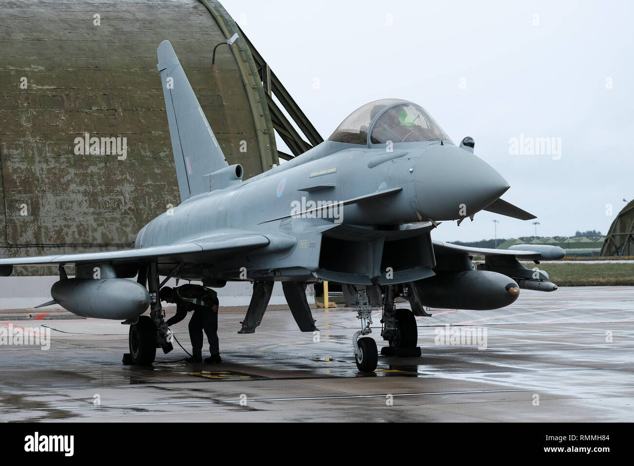 Ground crew conducting a pre-flight check over an RAF Tornado jet ...