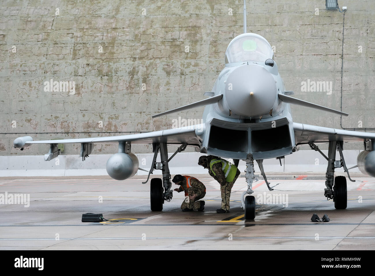 Ground crew conducting a pre-flight check over an RAF Tornado jet ...