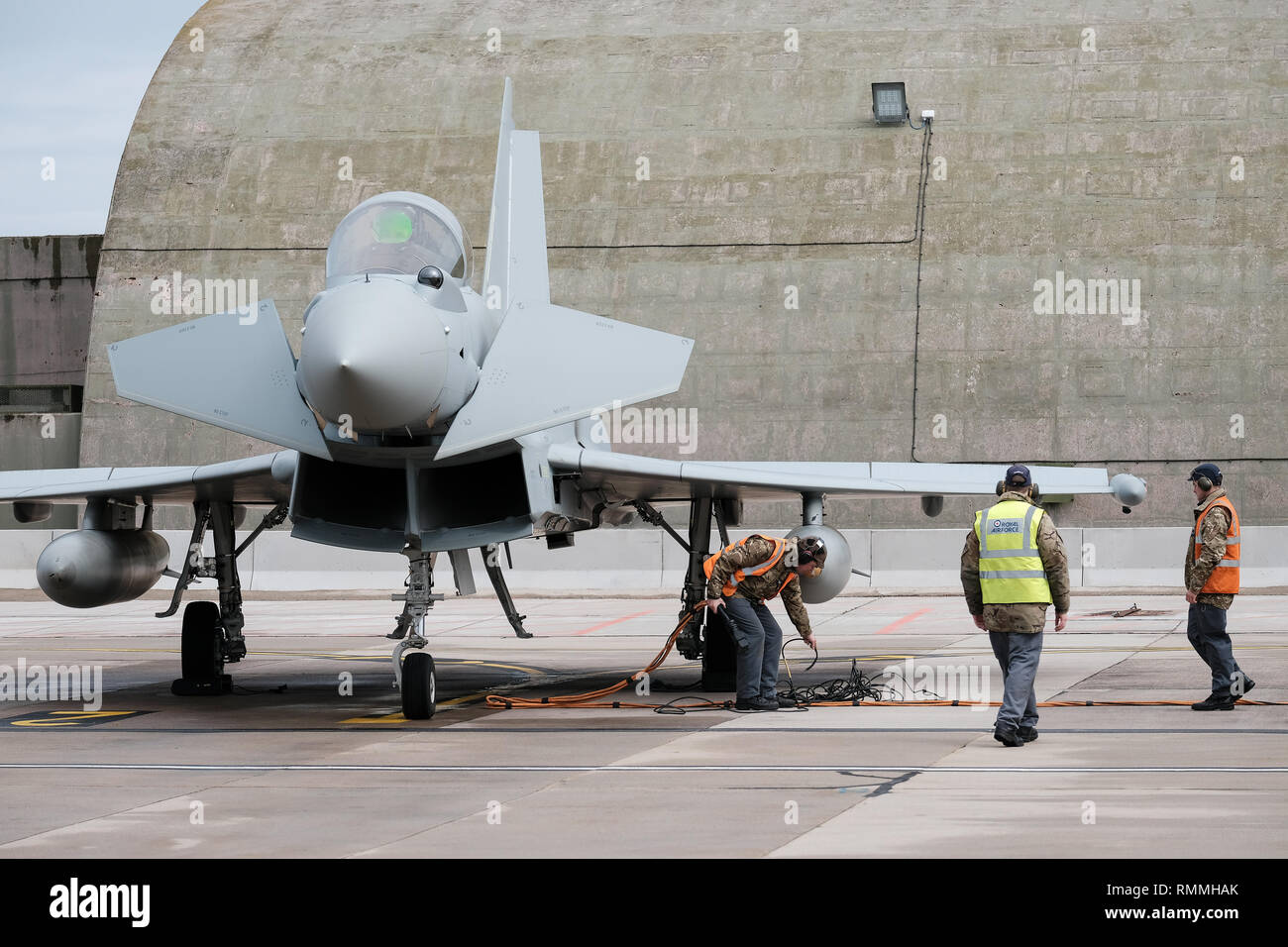 Ground crew checking over an RAF Tornado jet fighter at RAF Lossiemouth ...