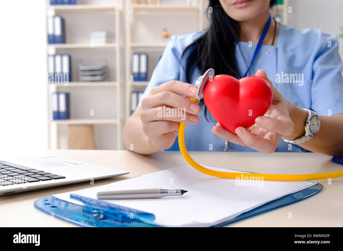 Female doctor cardiologist working in the clinic Stock Photo - Alamy