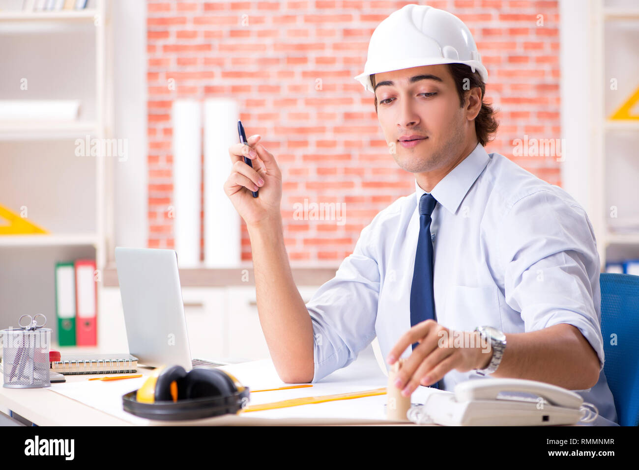 Construction supervisor working on blueprints Stock Photo - Alamy