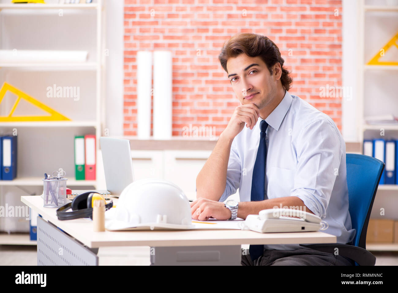 Construction supervisor working on blueprints Stock Photo - Alamy