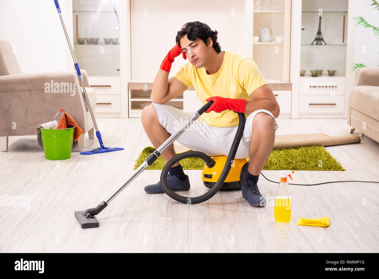 Young handsome man doing housework Stock Photo - Alamy
