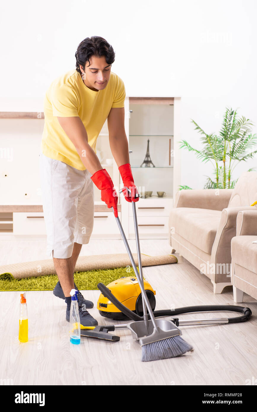 Young handsome man doing housework Stock Photo - Alamy